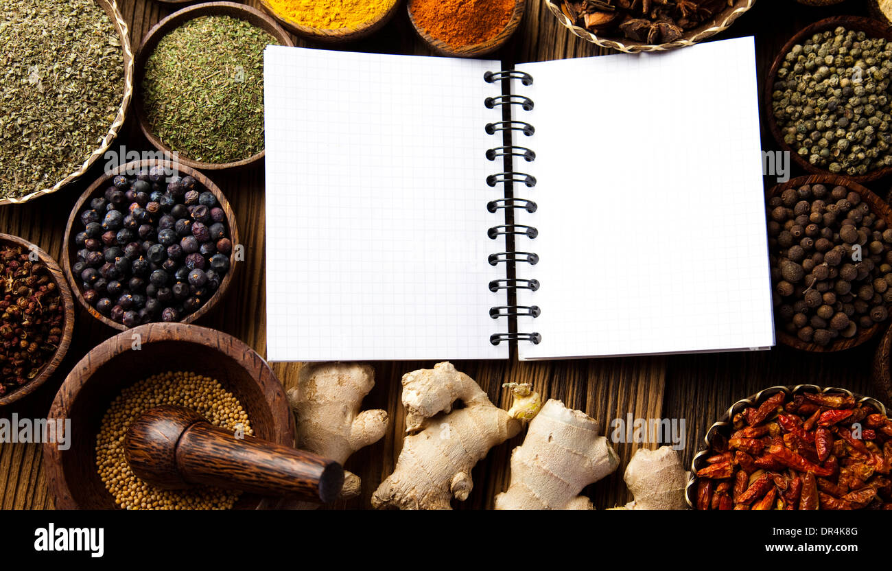 Cookbook and various spices Stock Photo - Alamy