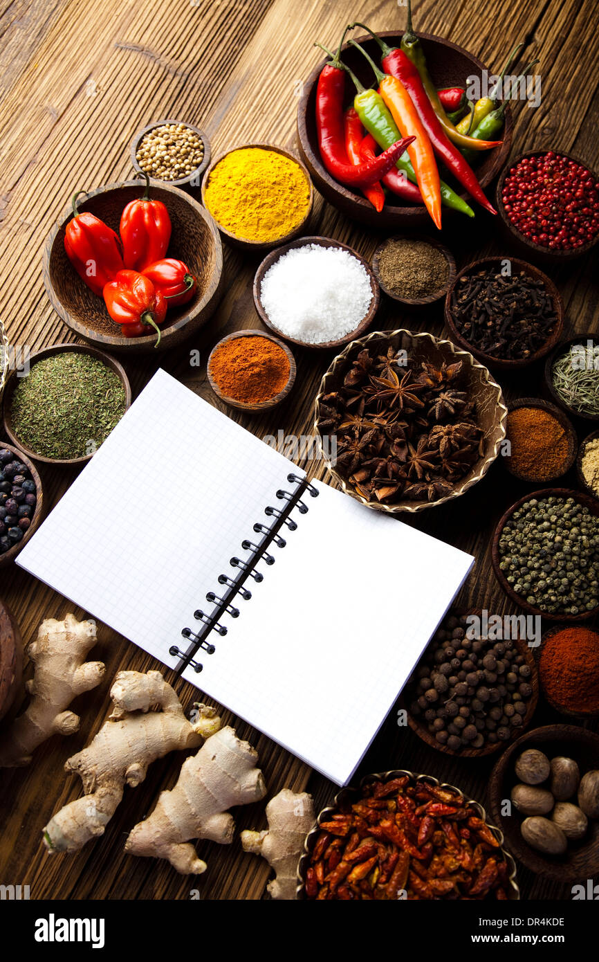 Cookbook and various spices Stock Photo - Alamy
