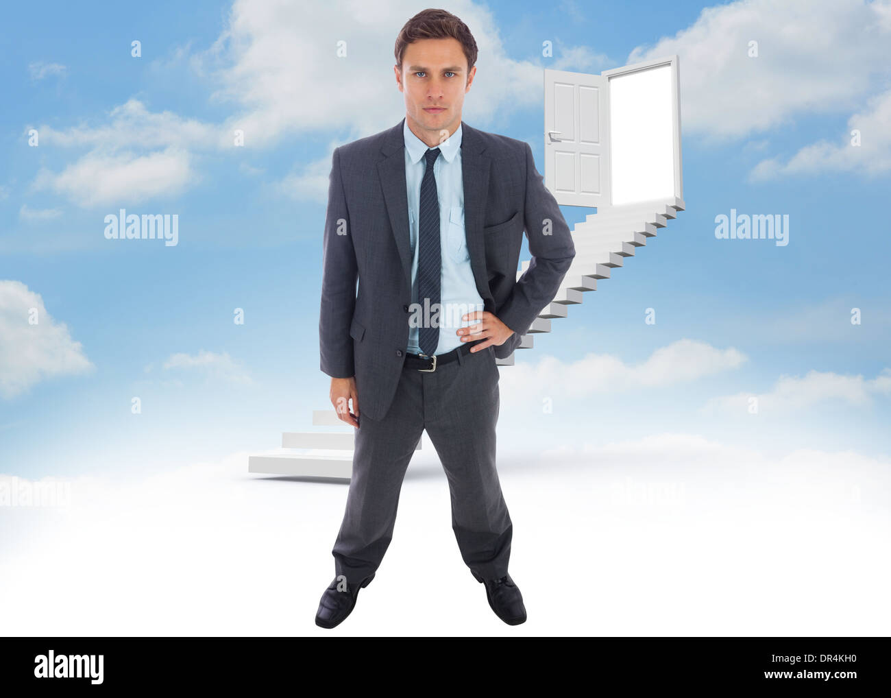 Composite image of stern businessman standing with hand on hip Stock ...