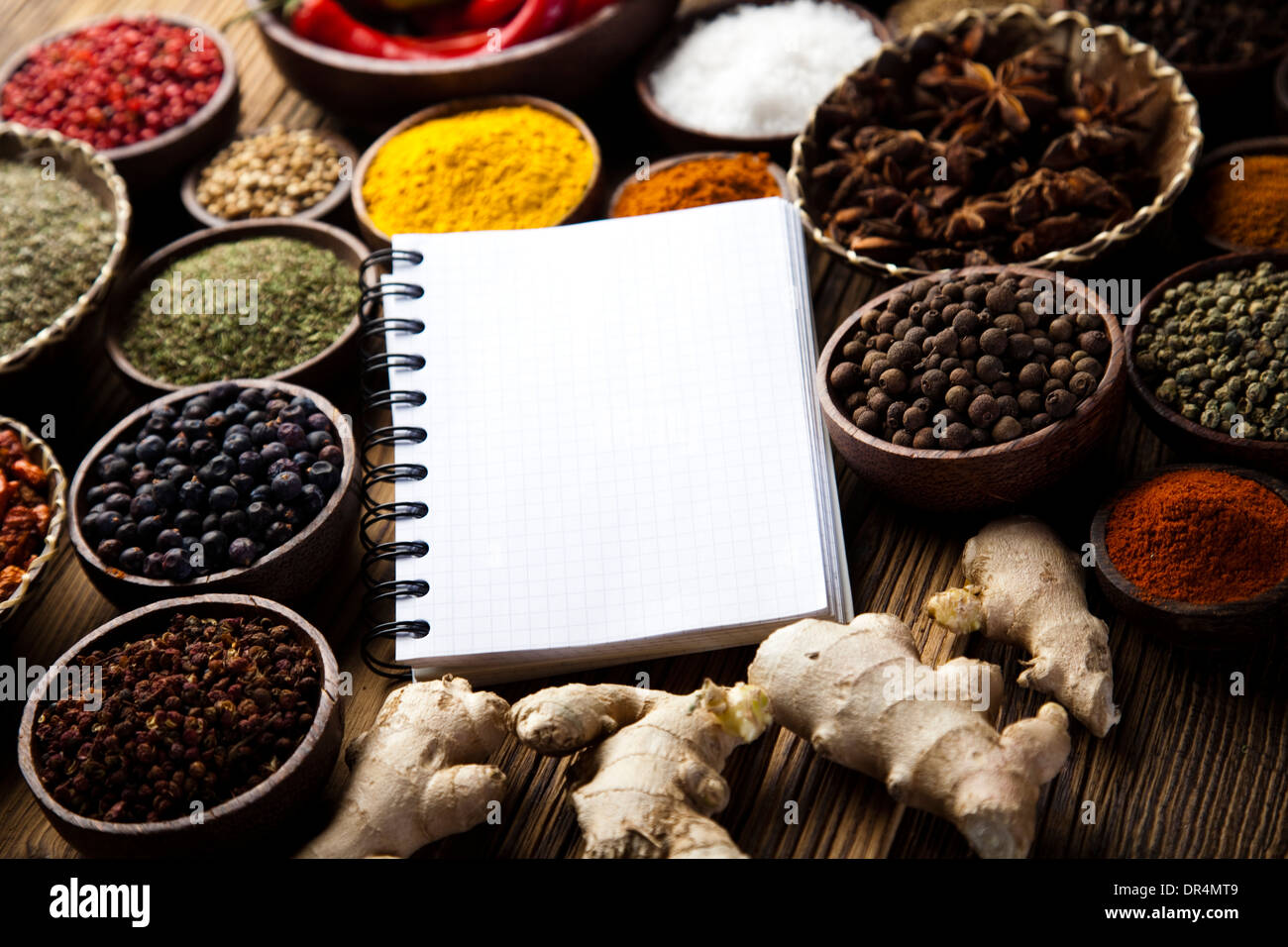 Cookbook and various spices Stock Photo - Alamy