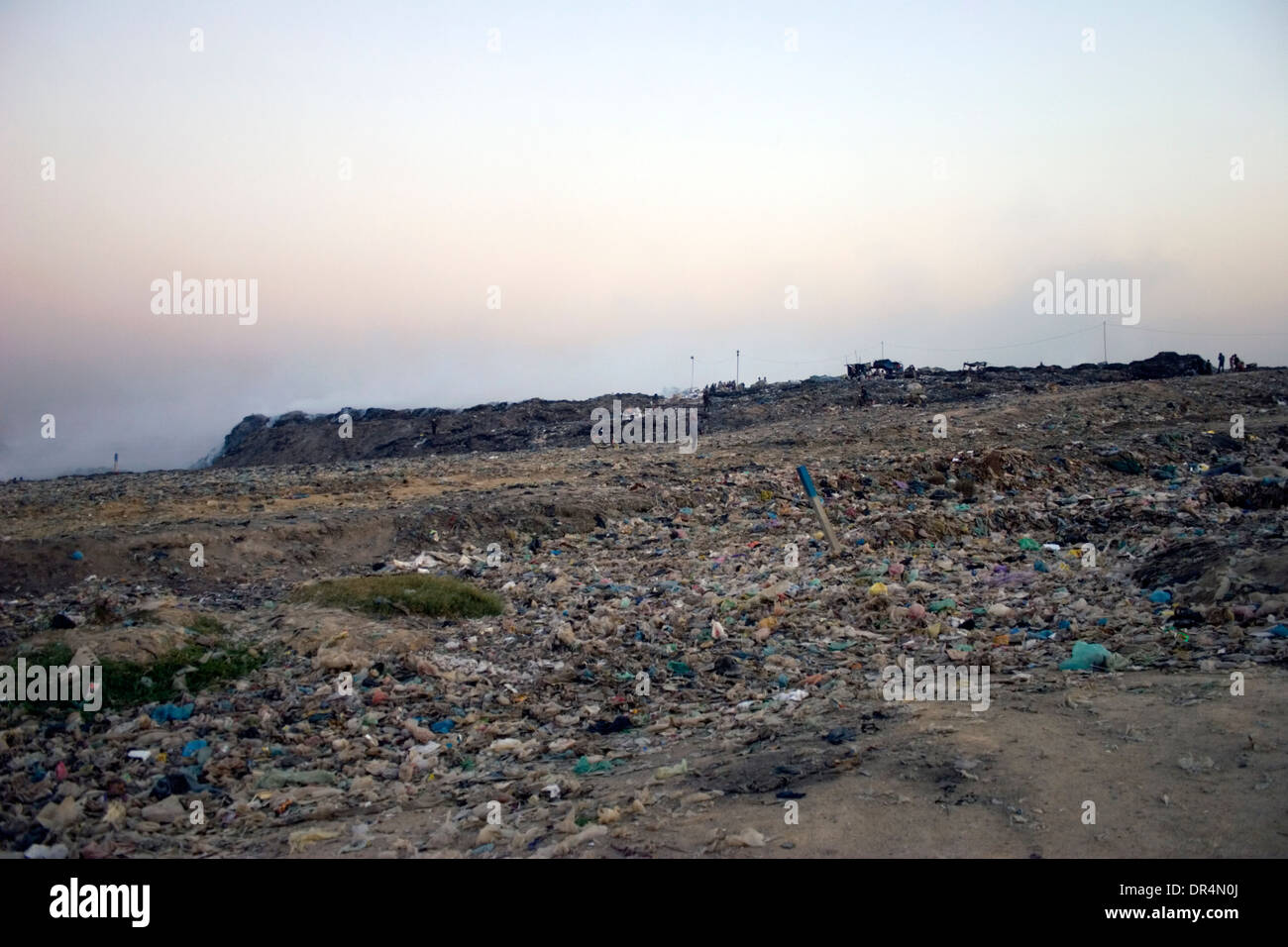 A large mountain of garbage provides the work environment at the toxic ...