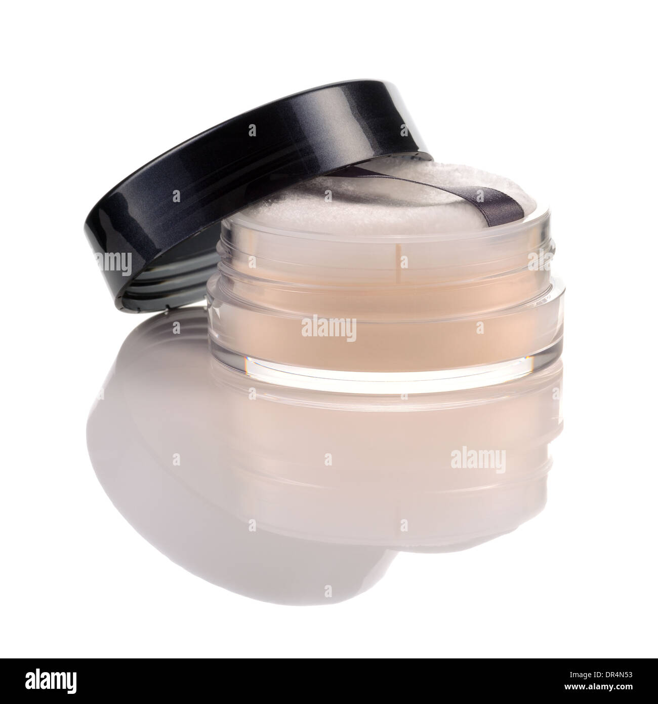 Translucent loose powder in jar with puff isolated on white background ...