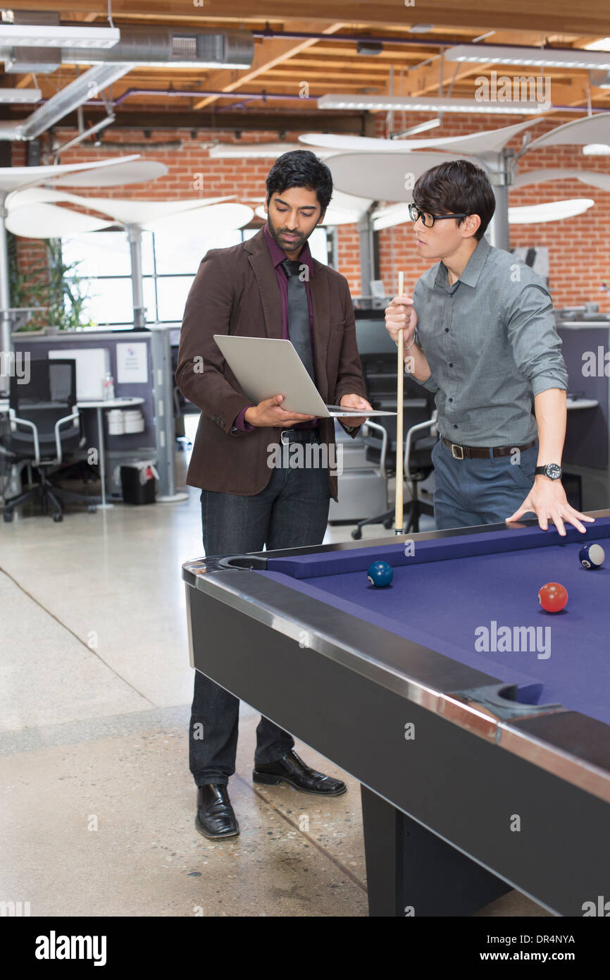Businessmen talking in office lounge area Stock Photo - Alamy