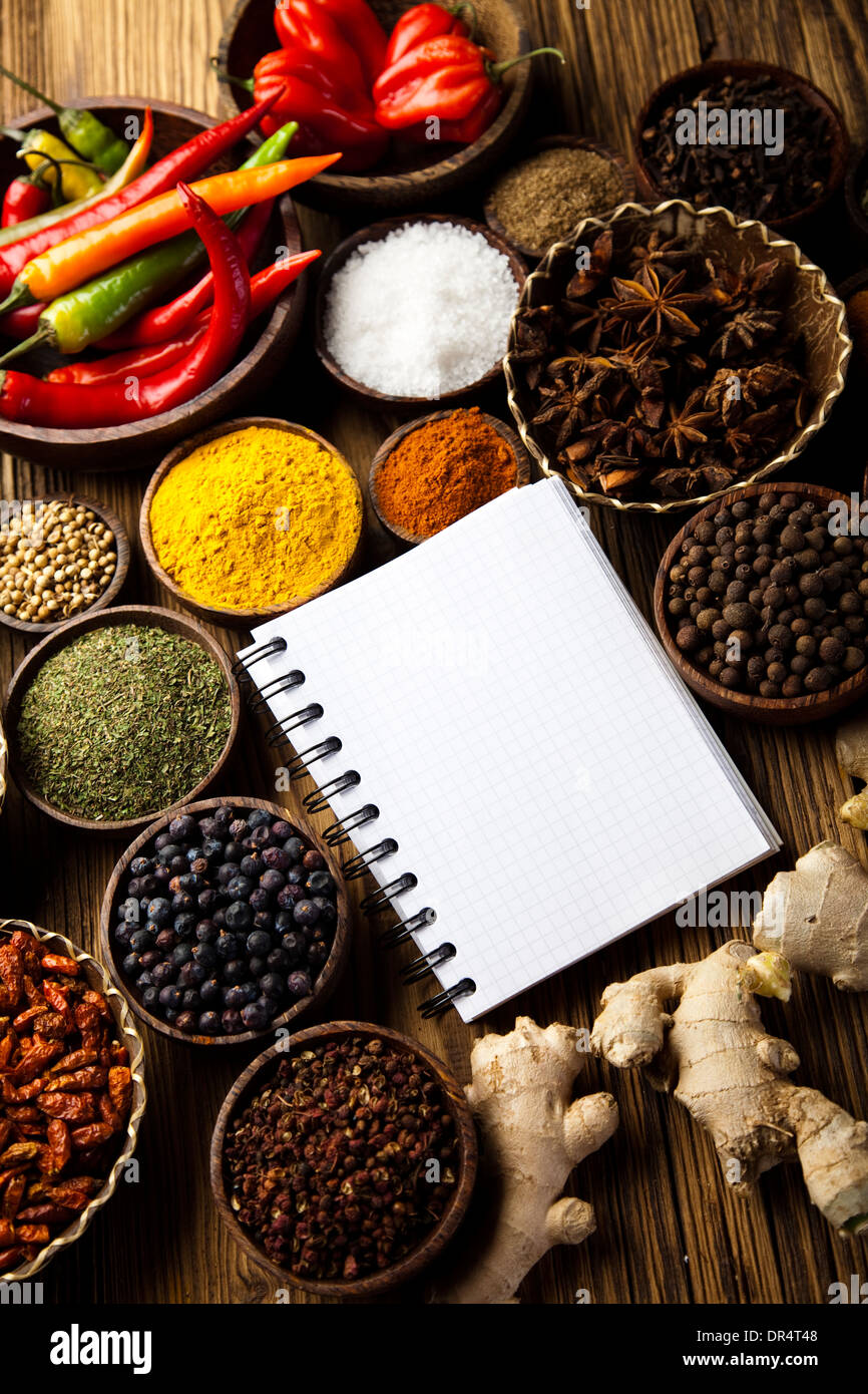 Cookbook and various spices Stock Photo - Alamy