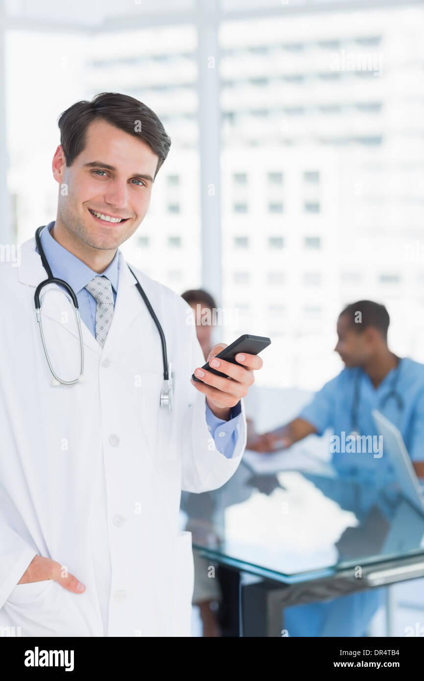 Doctor text messaging group hi-res stock photography and images - Alamy