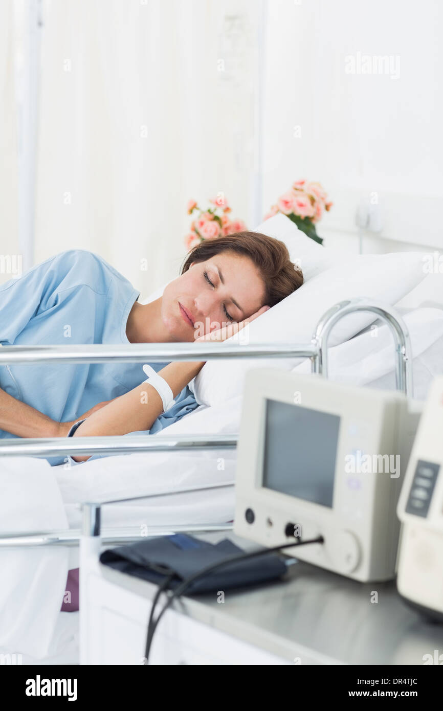 Female patient sleeping in medical bed Stock Photo - Alamy