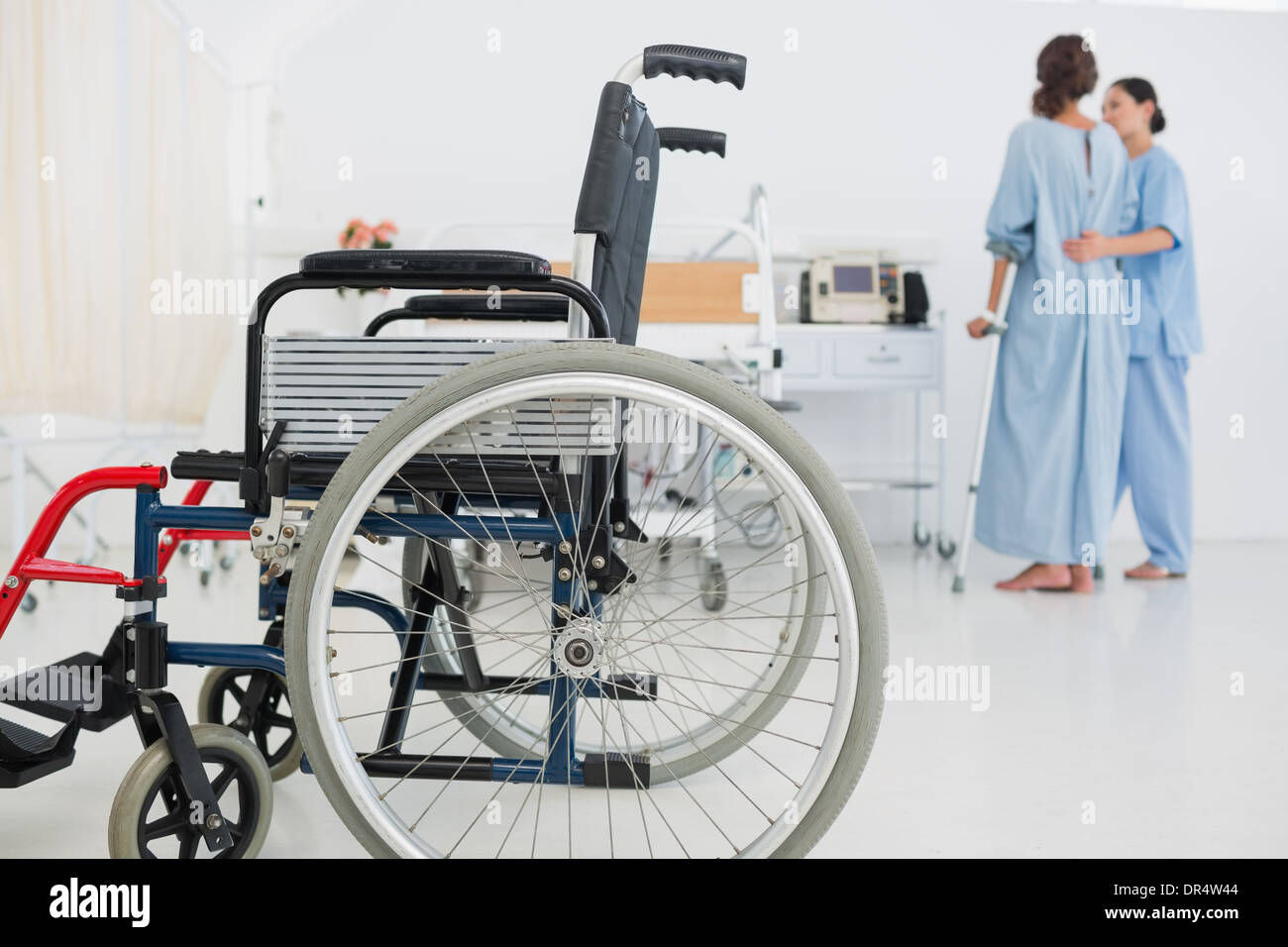 Medic helping patient walk hi-res stock photography and images - Alamy