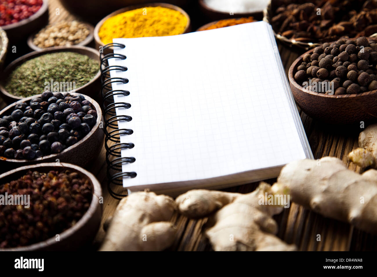 Cookbook and various spices Stock Photo - Alamy