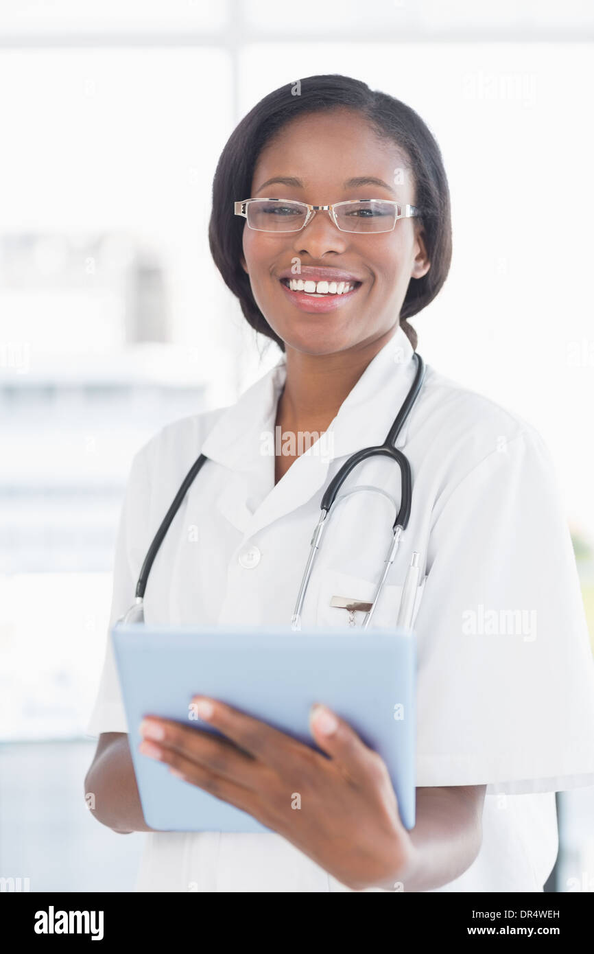 Cheerful african doctor using hi-res stock photography and images - Alamy