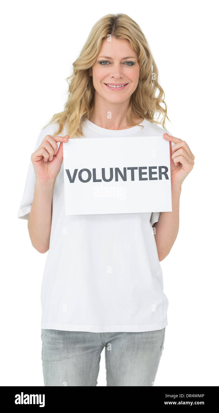 Portrait of a smiling young female volunteer holding placard Stock ...