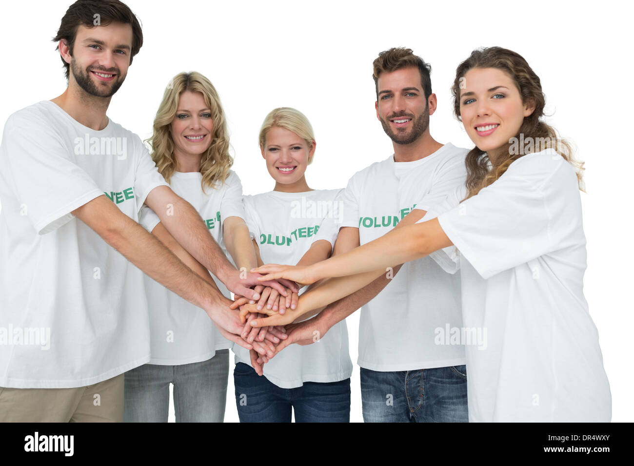 Group portrait of happy volunteers with hands together Stock Photo - Alamy
