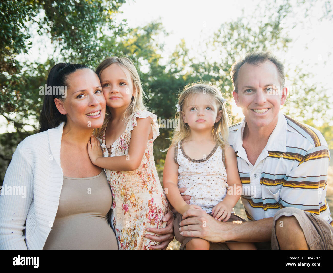 Family smiling together outdoors Stock Photo - Alamy
