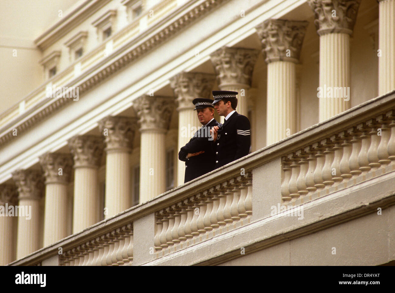 Two Met Police officers keep a lookout from a balcony during the annual ...
