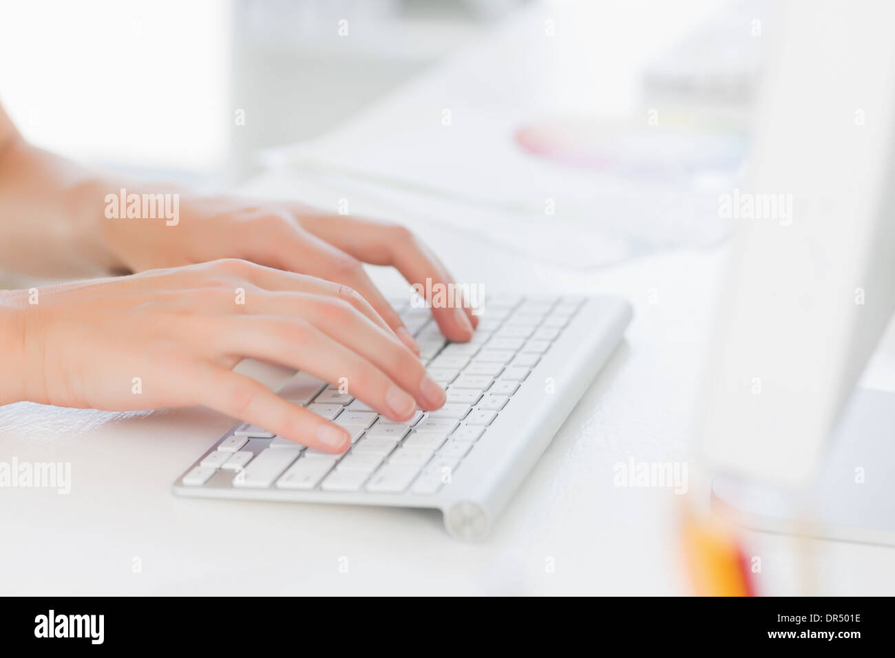 Closeup of hands using computer keyboard in office Stock Photo - Alamy