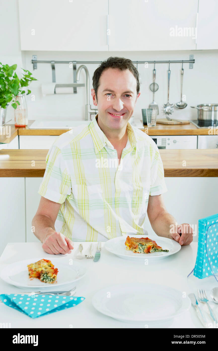 Man sitting dinner table hi-res stock photography and images - Alamy