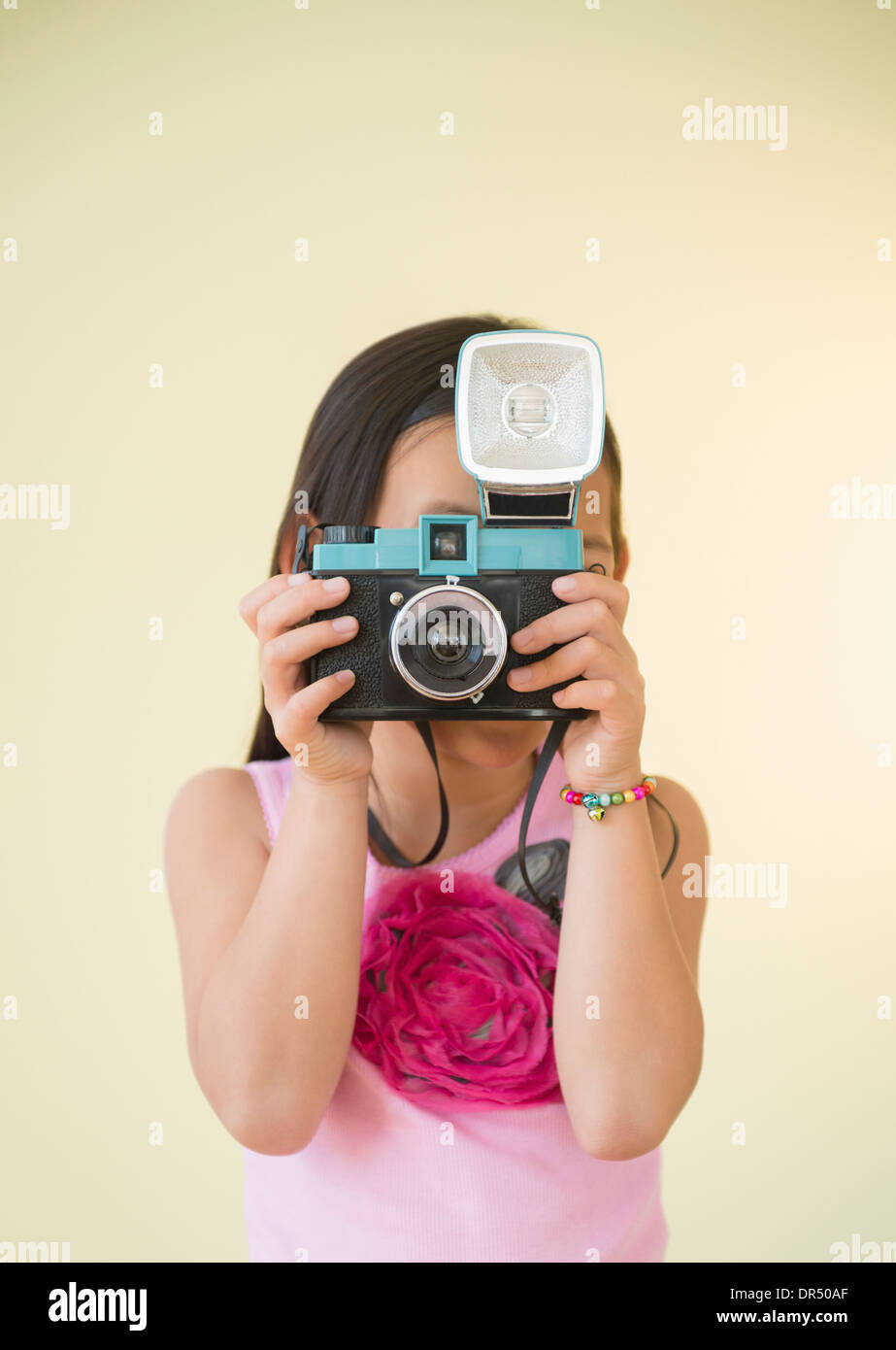 Korean girl using retro camera Stock Photo - Alamy