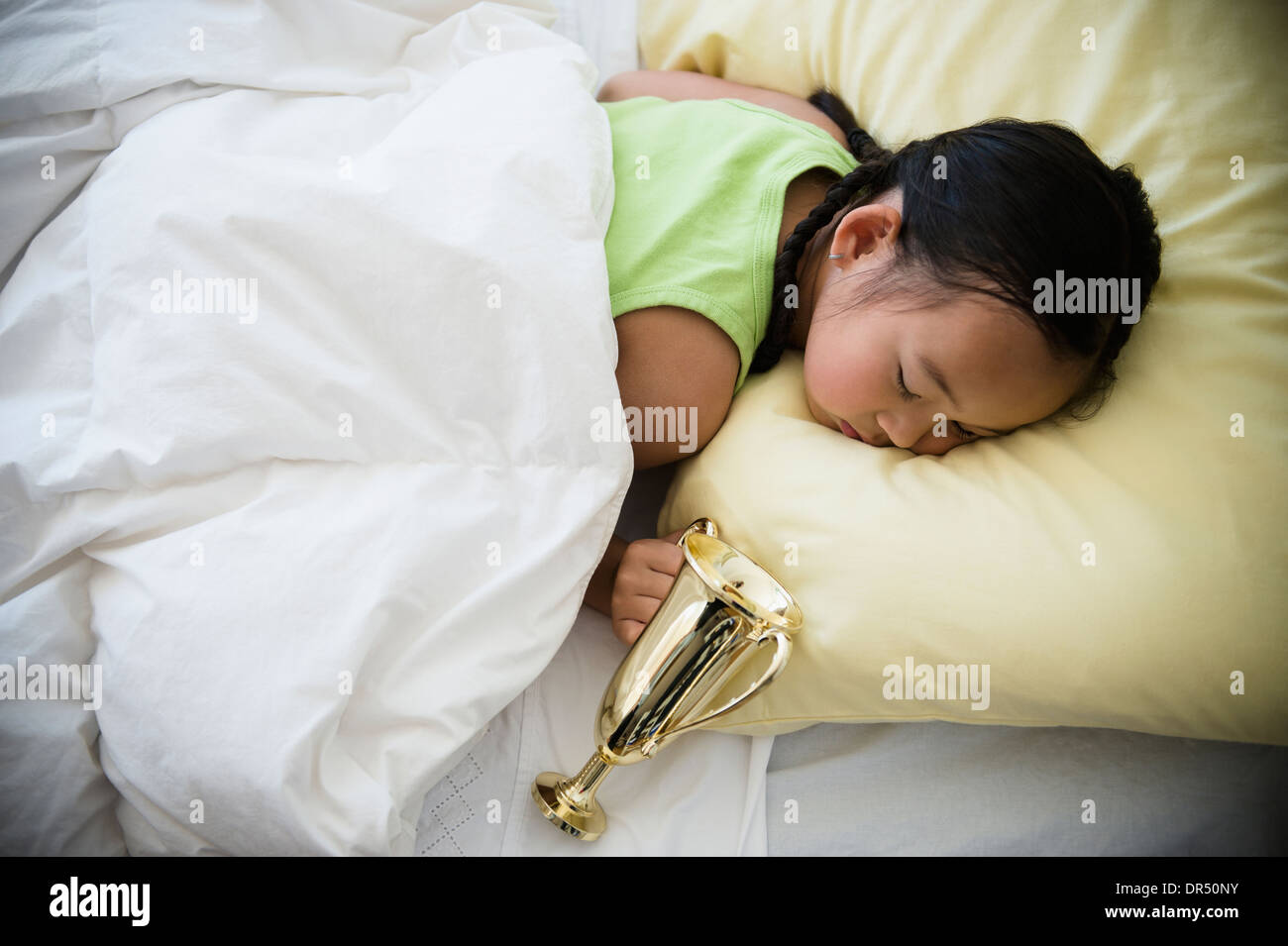 Korean girl sleeping with trophy Stock Photo - Alamy