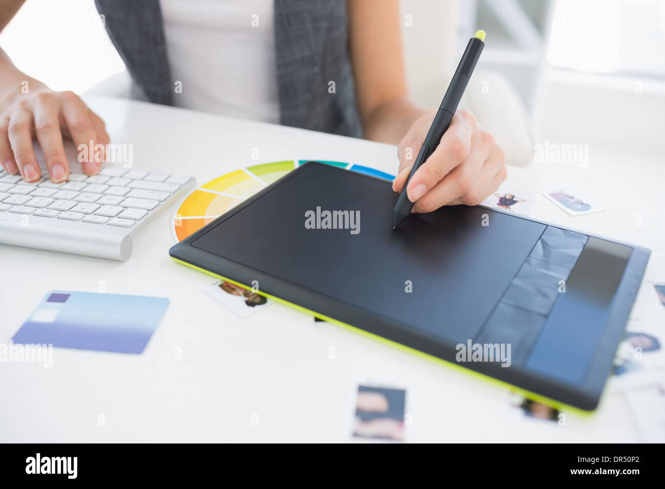 Female photo editor using graphics tablet Stock Photo - Alamy