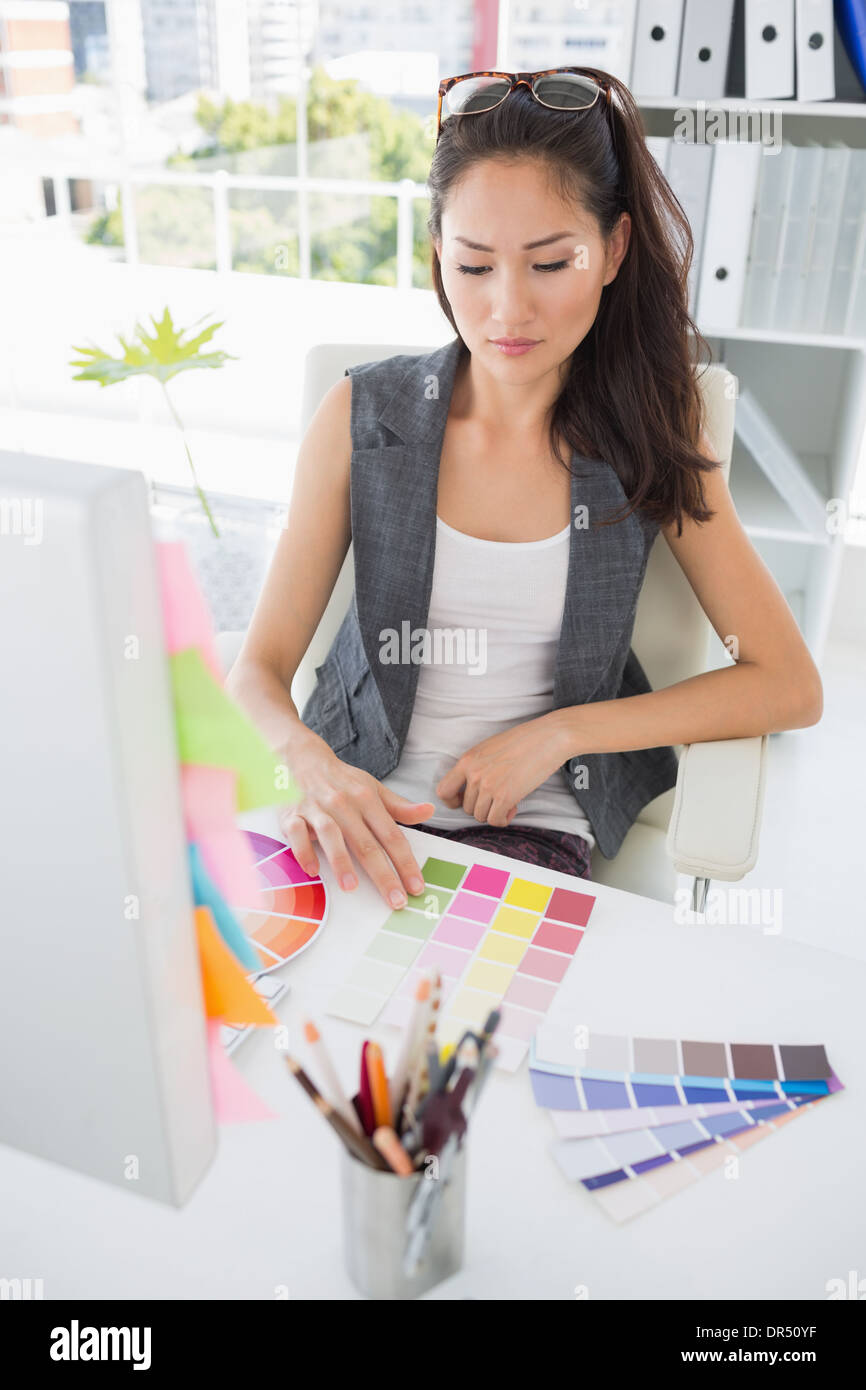 Concentrated female photo editor at work Stock Photo - Alamy
