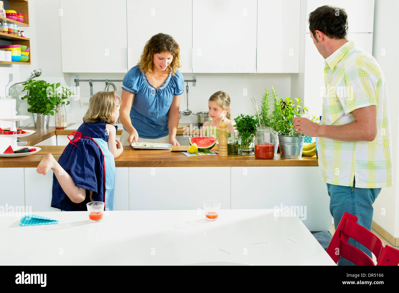 Family In The Kitchen Stock Photo - Alamy