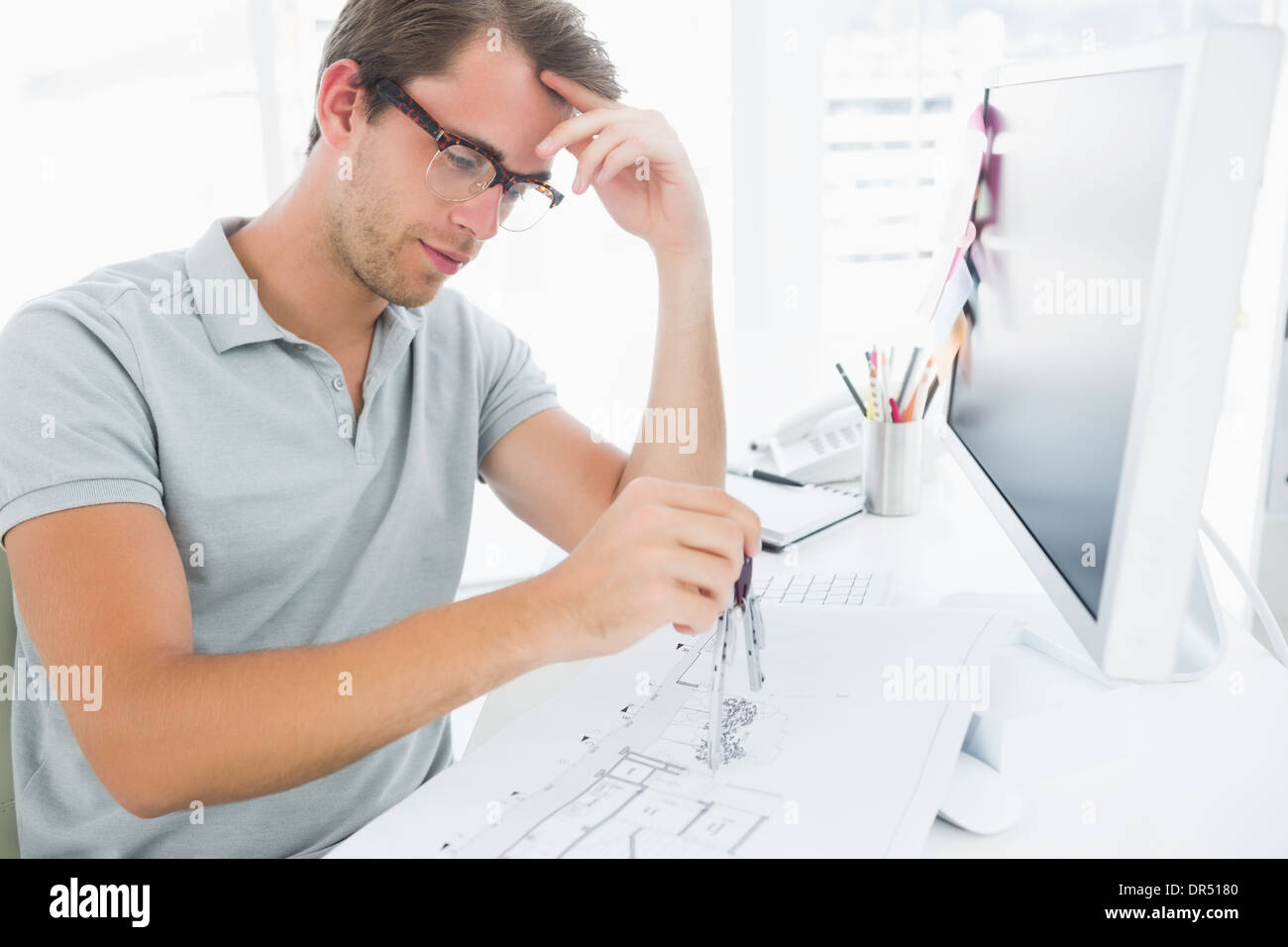 Man using compass on design Stock Photo - Alamy