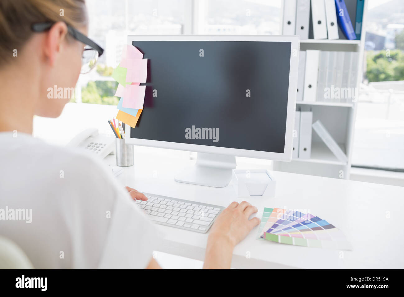 Working at computer rear view hi-res stock photography and images - Alamy