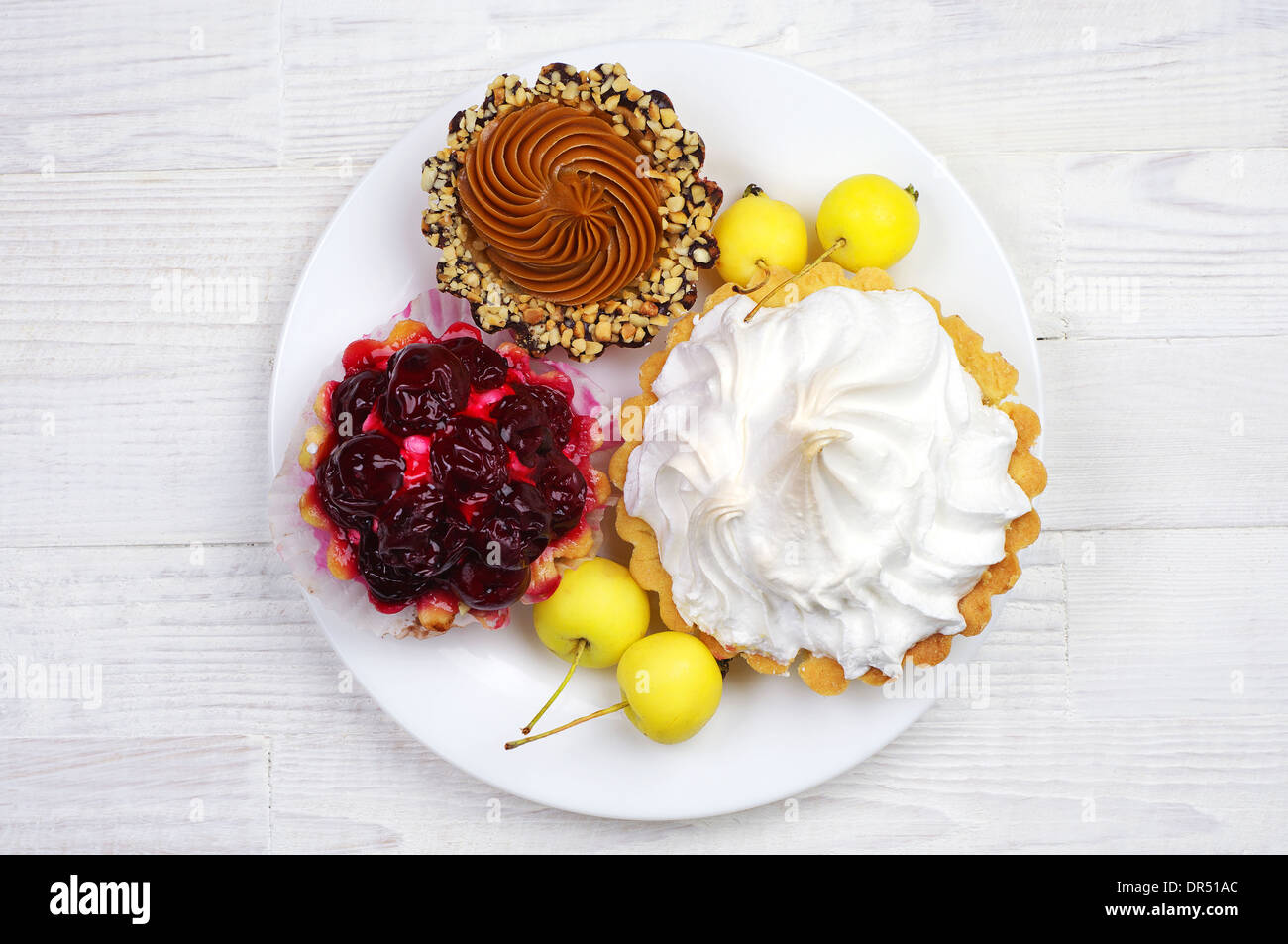Different cake in a plate on table. Top view Stock Photo - Alamy