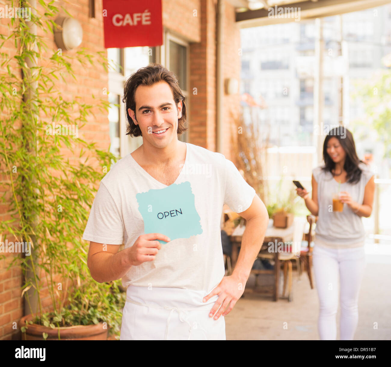 Woman and man holding sign hi-res stock photography and images - Alamy