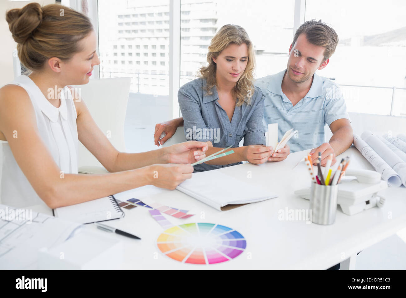 Group of artists working on designs Stock Photo - Alamy