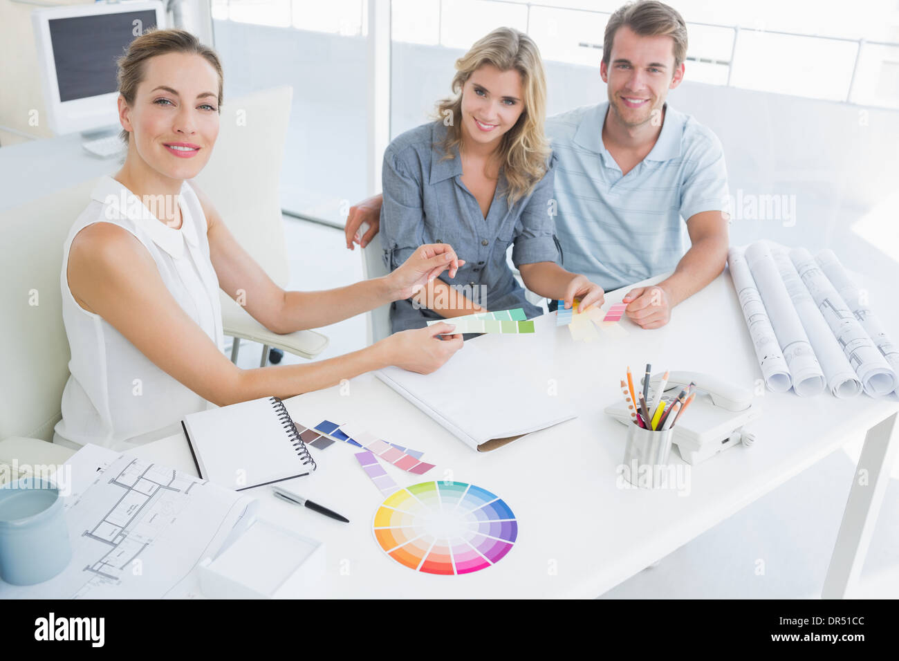 Group of artists working on designs Stock Photo - Alamy