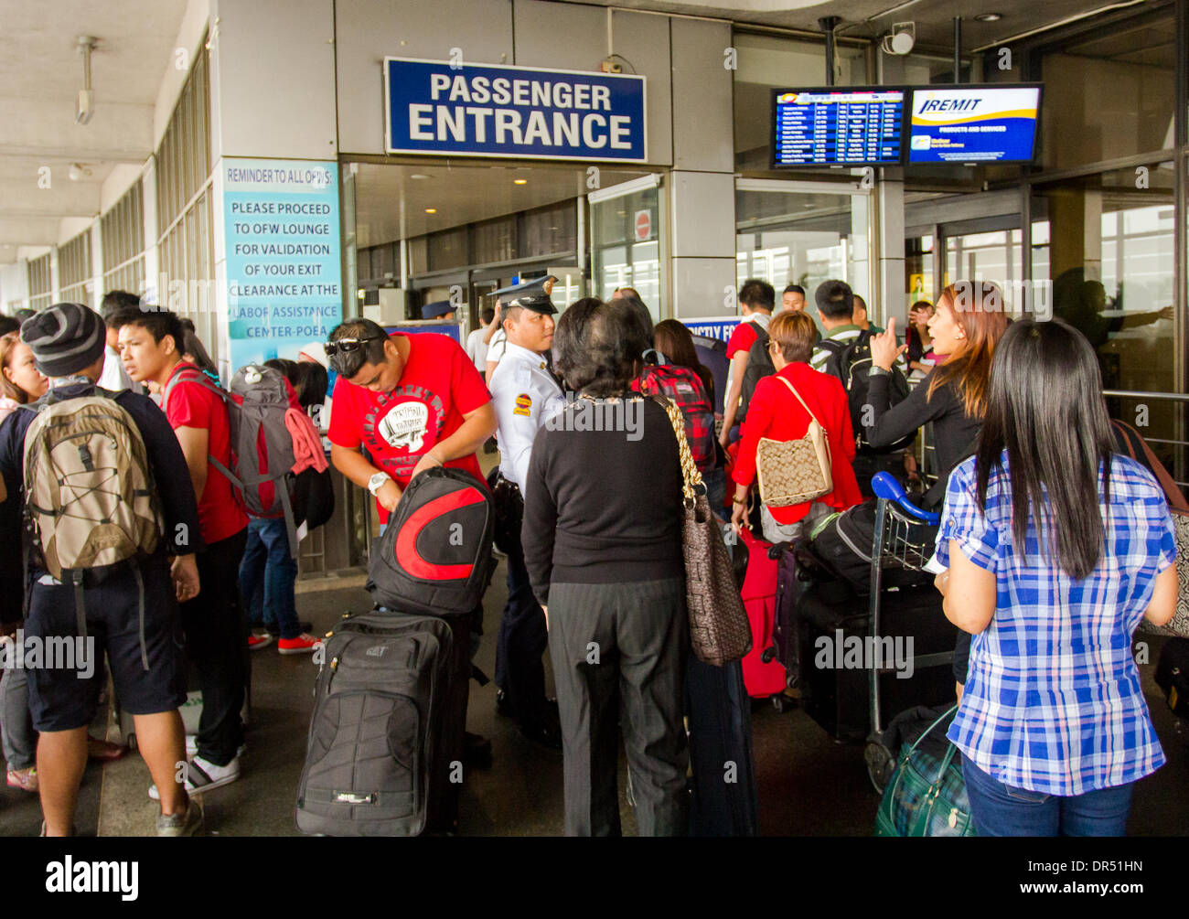 Pasay City, Philippines-January 20, 2014: Departing passengers about to ...