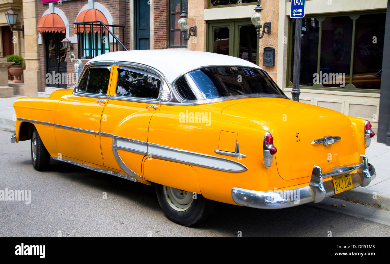 yellow 50's vintage car parked in the street Stock Photo - Alamy