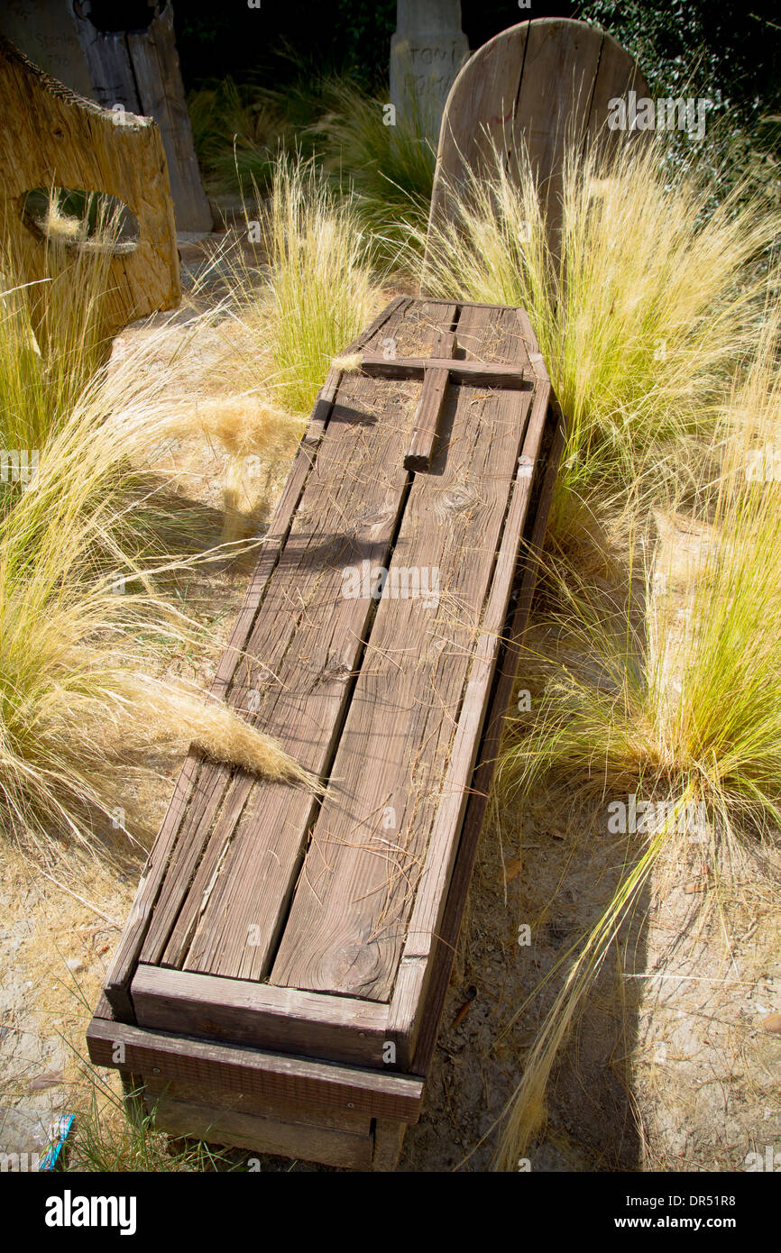 cementery with wooden coffin sticking out of the ground Stock Photo - Alamy