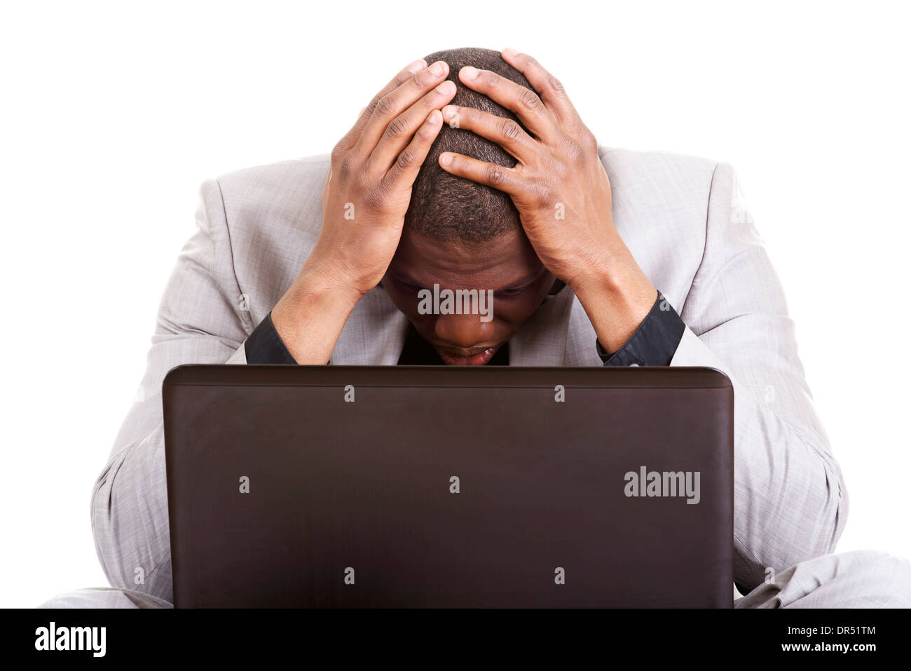 Stressed businessman working on laptop, isolated on white Stock Photo ...