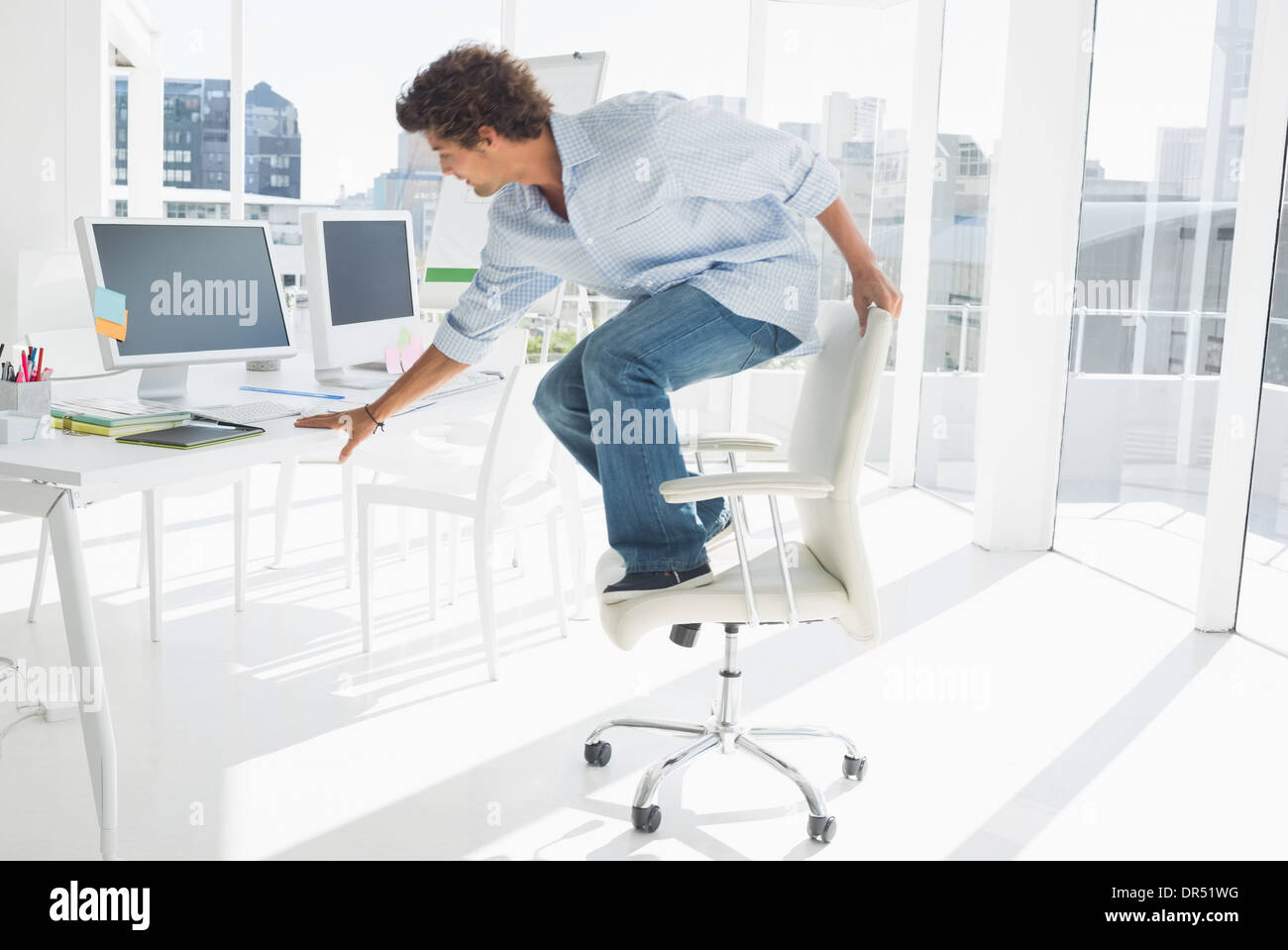 Man standing over desk hi-res stock photography and images - Alamy