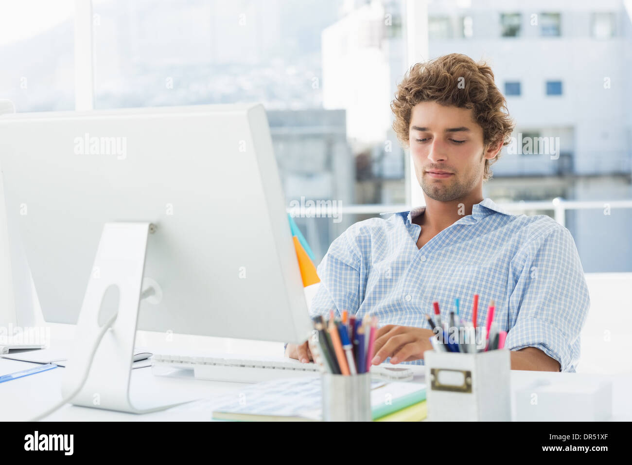 Office computer young man hi-res stock photography and images - Alamy