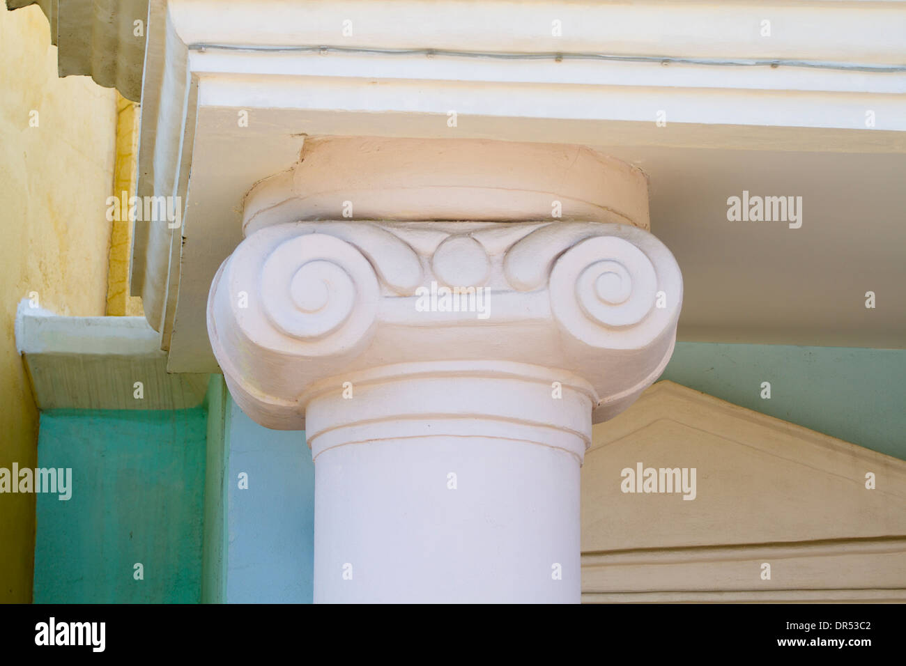 front white column's capital supporting a colouful structure Stock ...