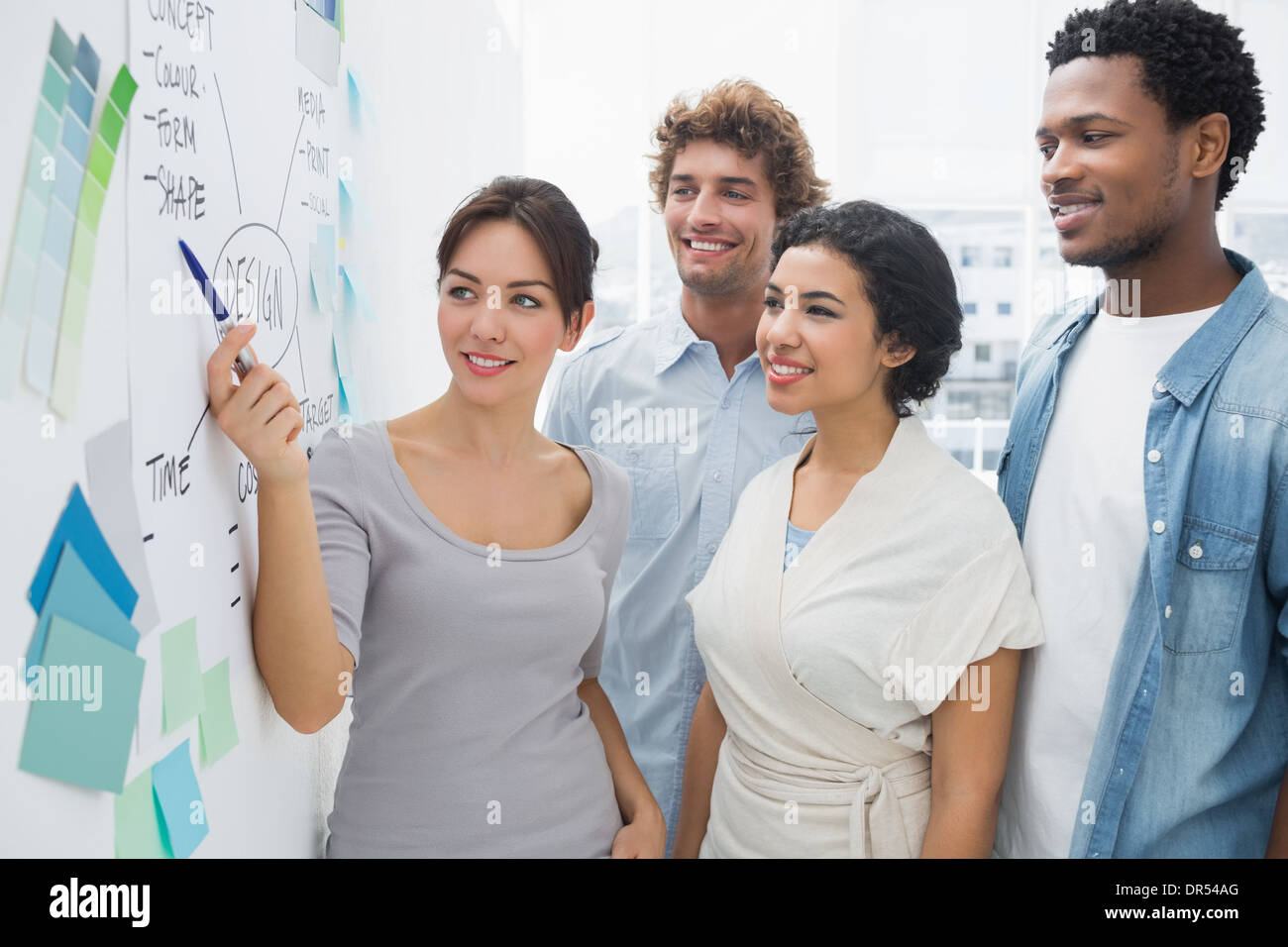 Woman pointing whiteboard in hi-res stock photography and images - Alamy