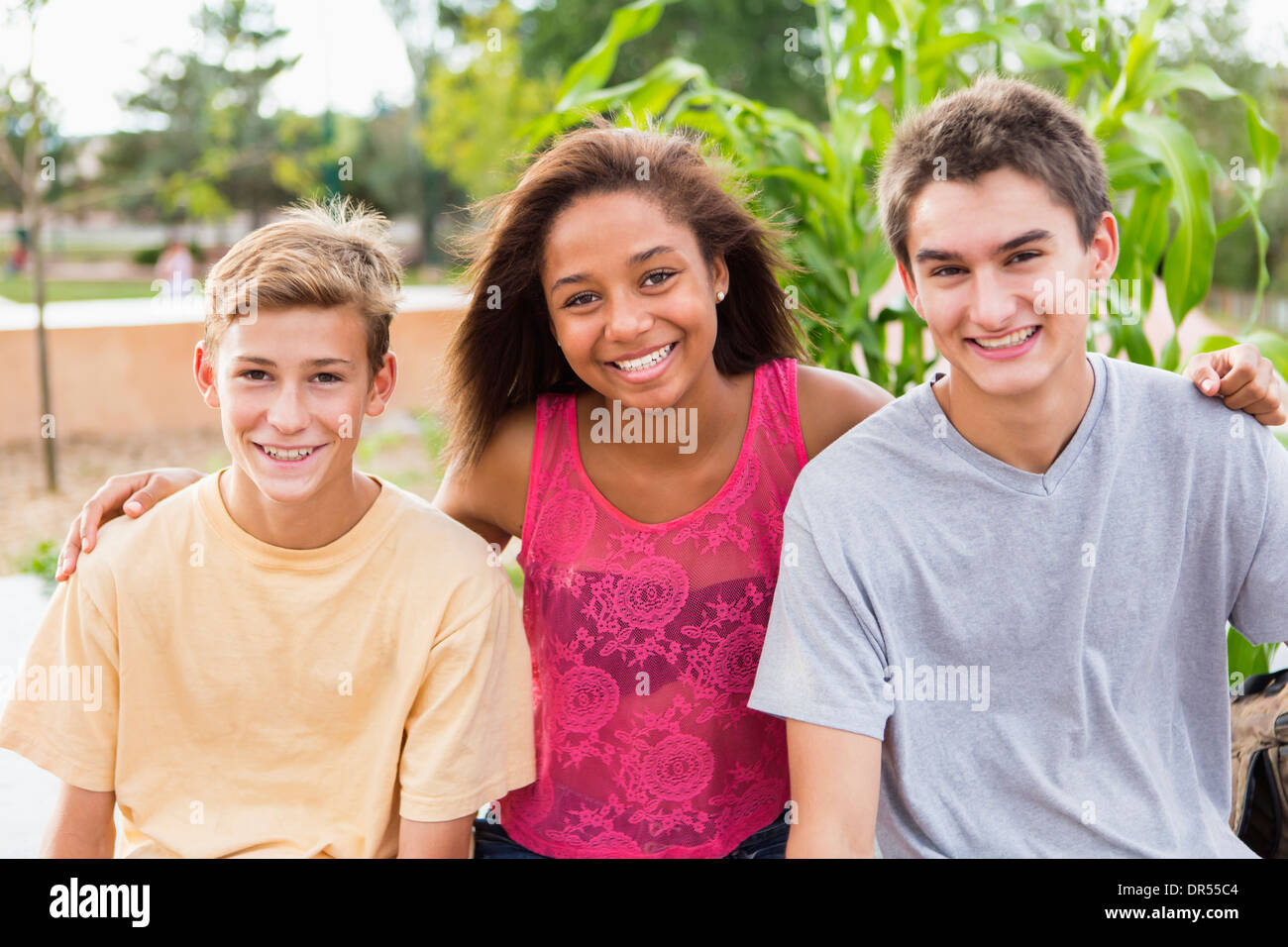 Teenagers smiling together outdoors Stock Photo - Alamy