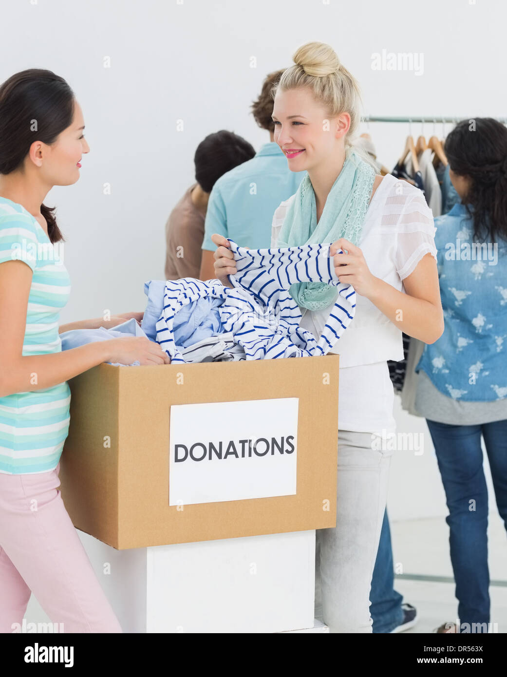 People with clothes donation Stock Photo - Alamy