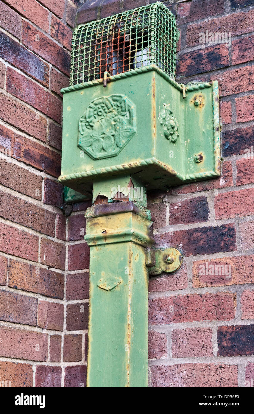 An old cast iron drainpipe and rainwater hopper damaged by rust (UK ...