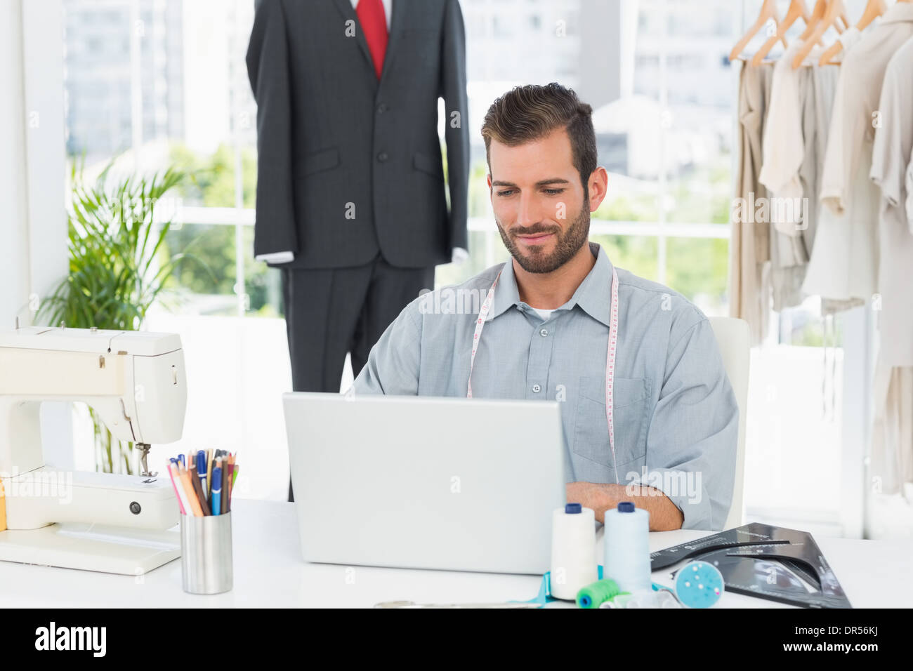 Fashion designer using laptop in hi-res stock photography and images ...