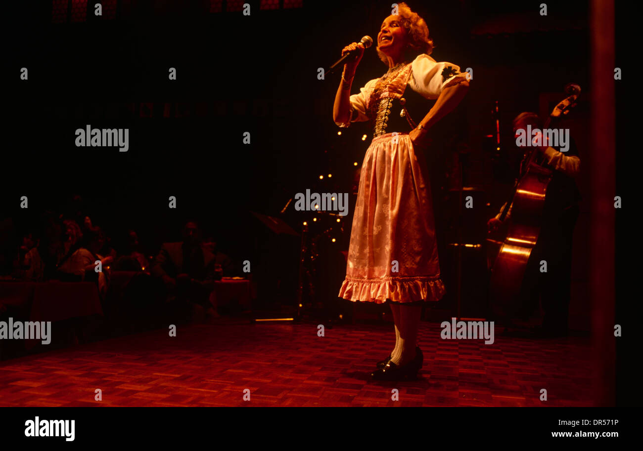 A yodelling lady singer belts out traditional Alpine Swiss songs during ...
