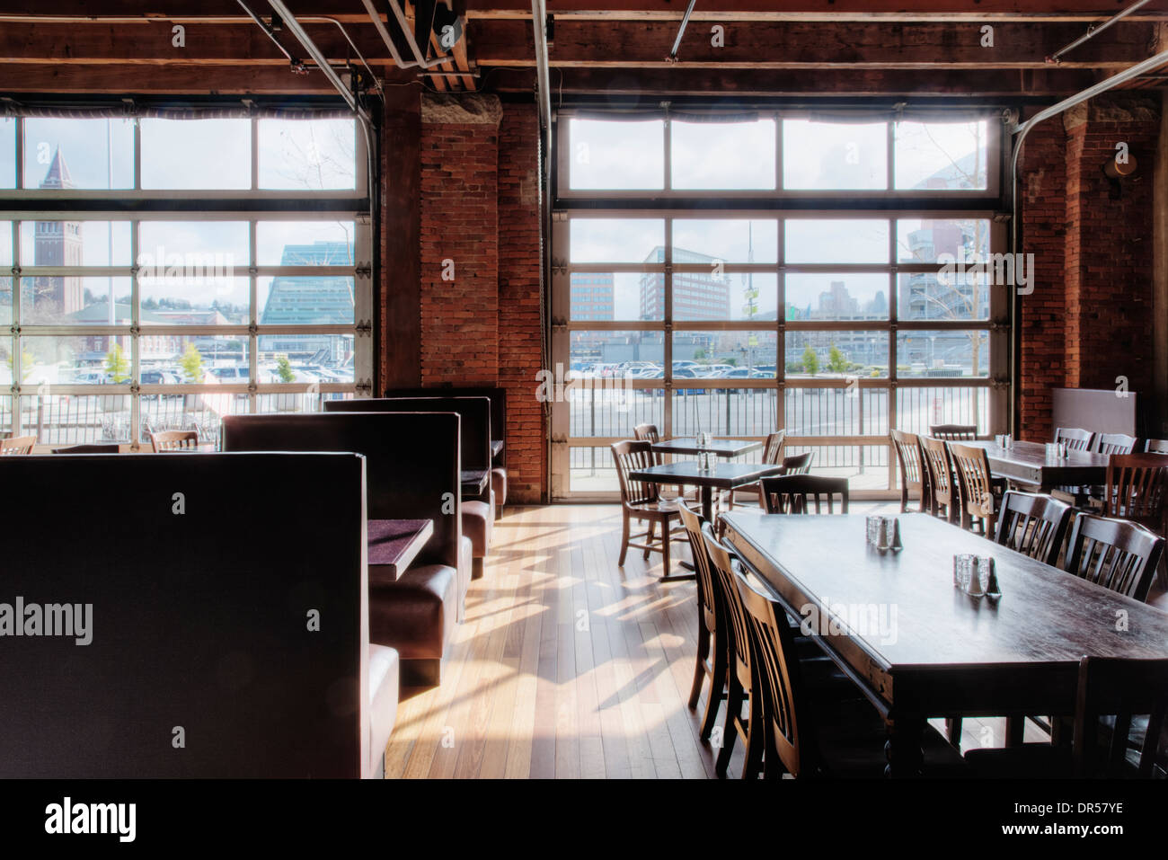 Tables and chairs in empty restaurant Stock Photo - Alamy