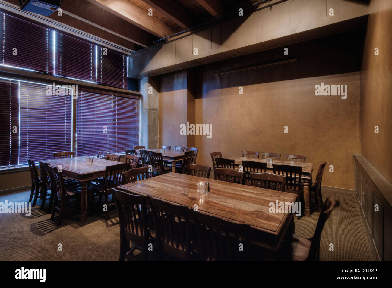 Tables and chairs in empty restaurant Stock Photo - Alamy