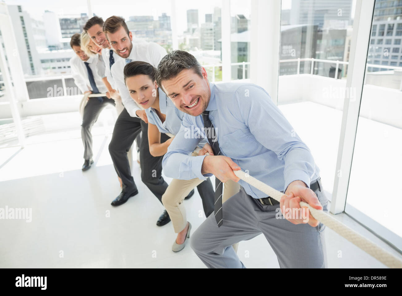 Group business people pulling rope hi-res stock photography and images ...