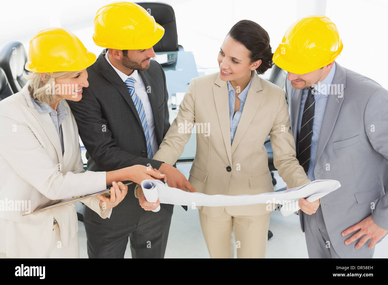 Engineer co-workers discussing a project Stock Photo - Alamy