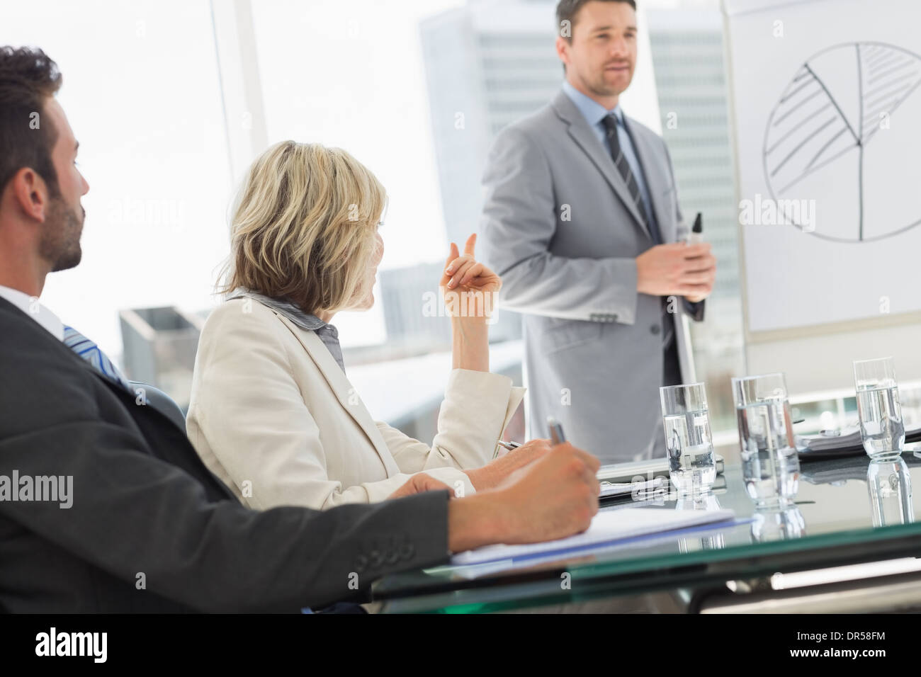Business people in office at presentation Stock Photo - Alamy