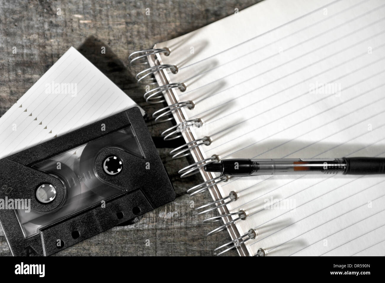Cassette tape and blank notebook on wooden surface Stock Photo - Alamy