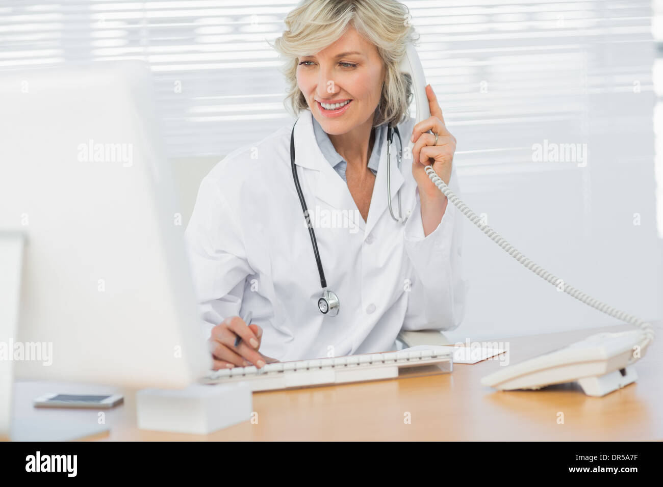 Doctor phone computer hi-res stock photography and images - Alamy